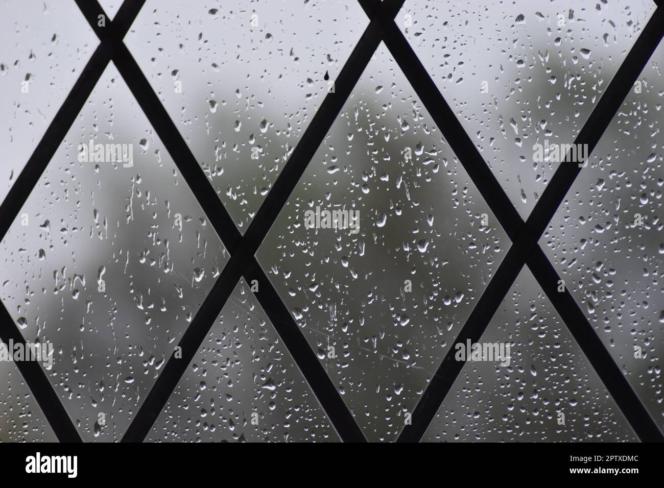 Raindrops on a leaded window pane Stock Photo - Alamy
