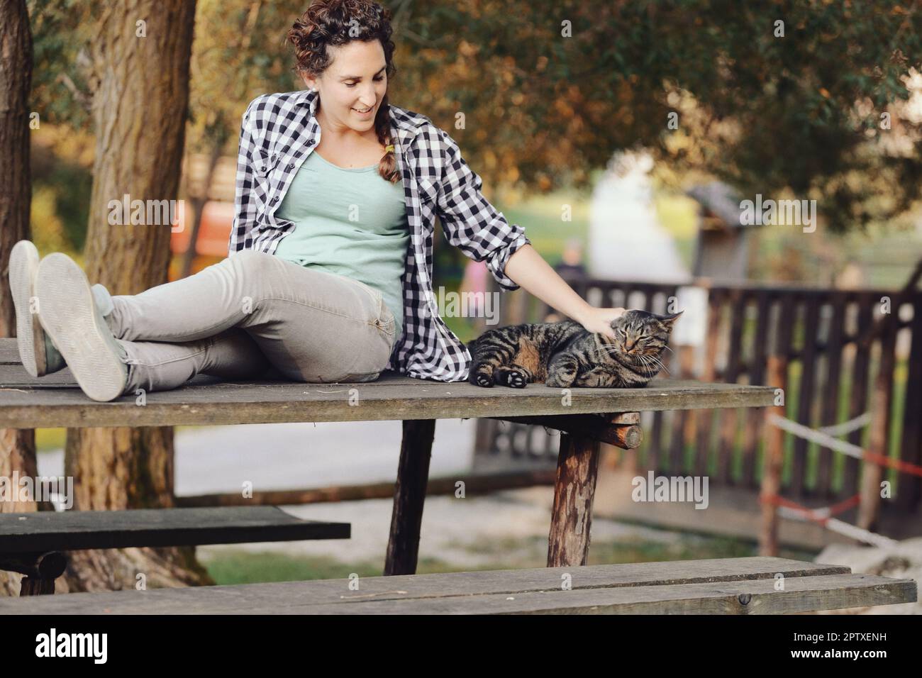 Cuddling in nature between humans and cats is the ultimate goal of ...