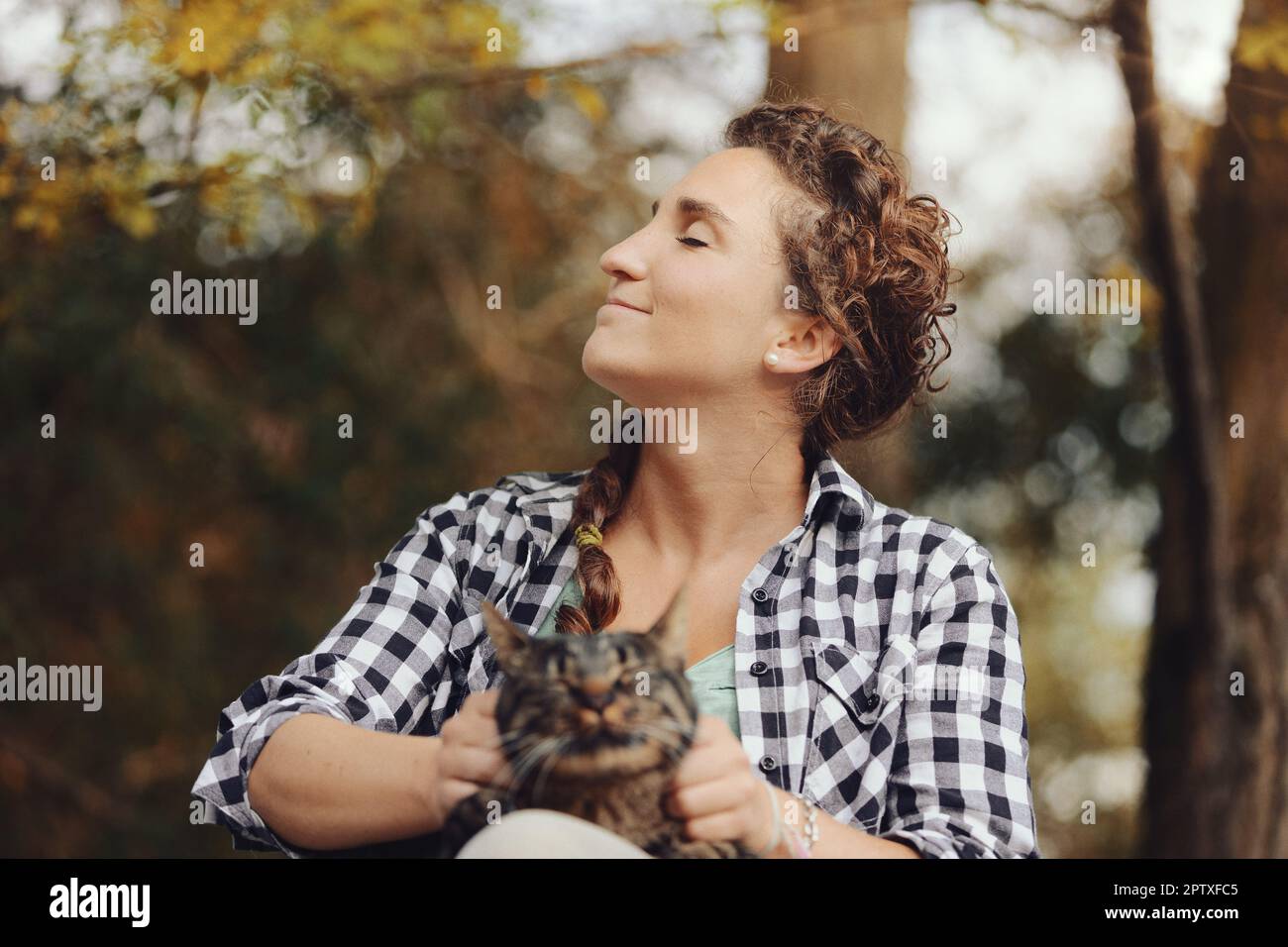 Cuddling in nature between humans and cats is the ultimate goal of ...