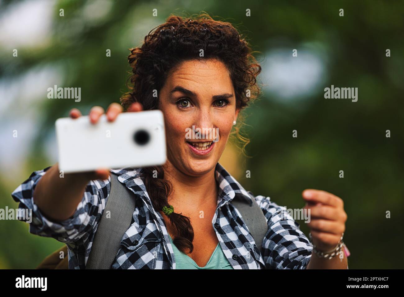 Human photographer is taking cell phone pictures of someone and giving ...