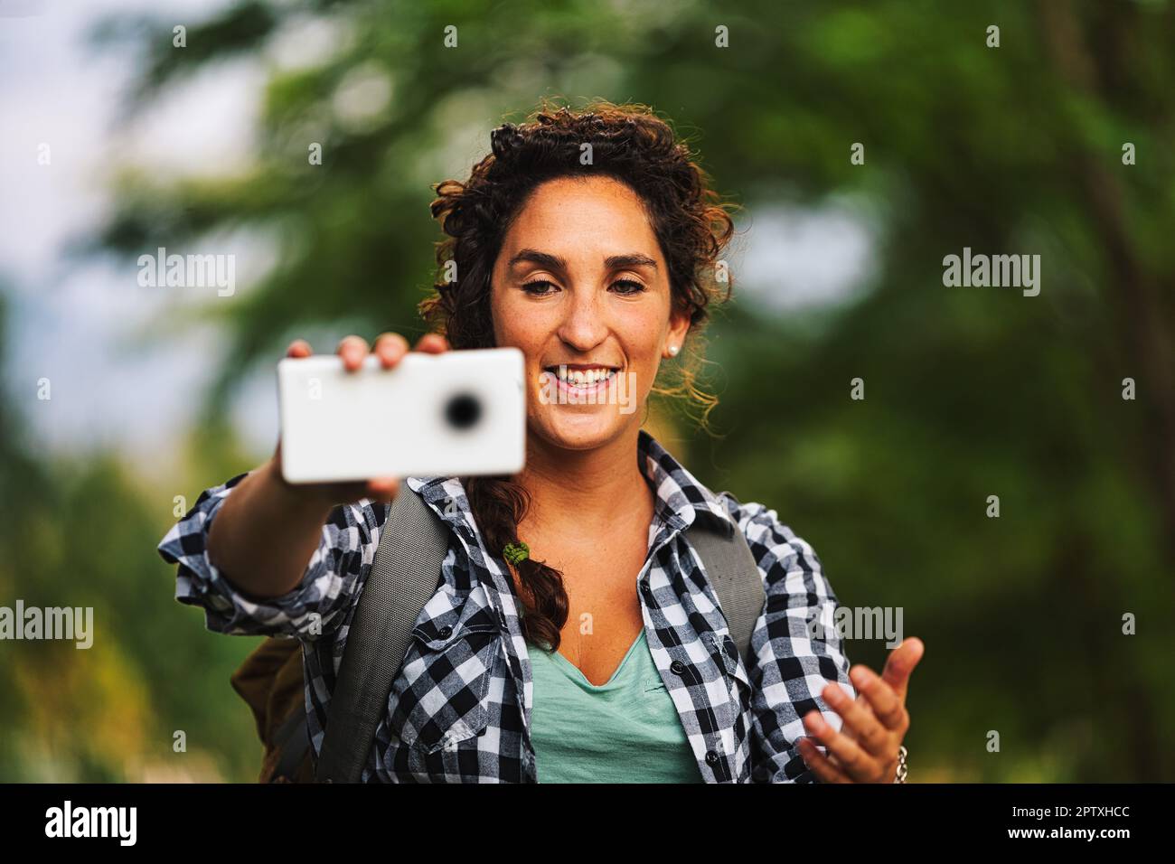 Human photographer is taking cell phone pictures of someone and giving ...