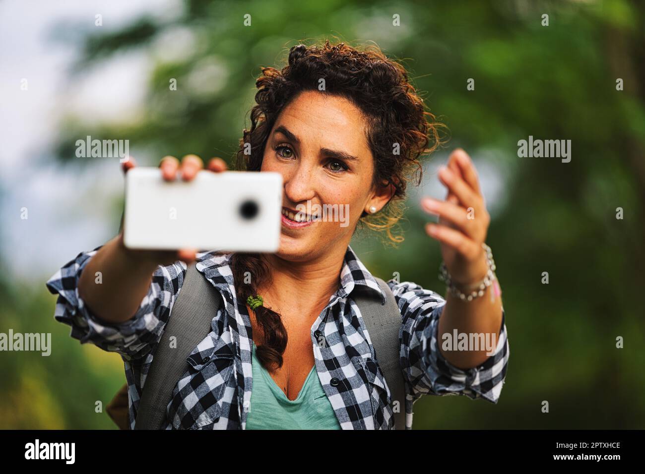 Human photographer is taking cell phone pictures of someone and giving ...