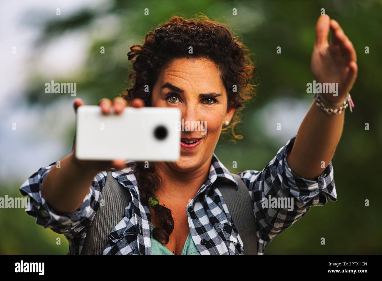 Human photographer is taking cell phone pictures of someone and giving ...