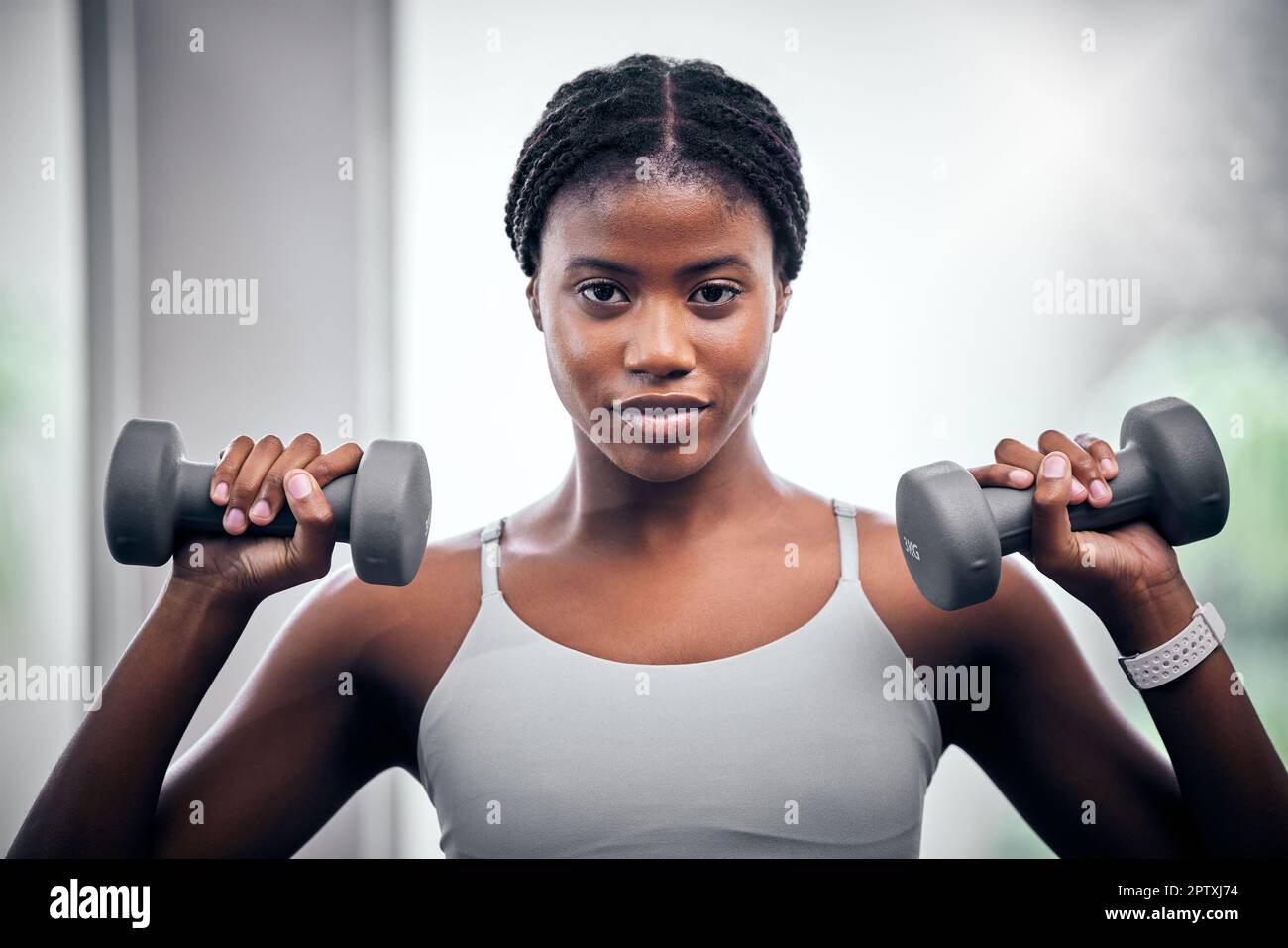 Face portrait, dumbbells and black woman training in gym for muscle ...