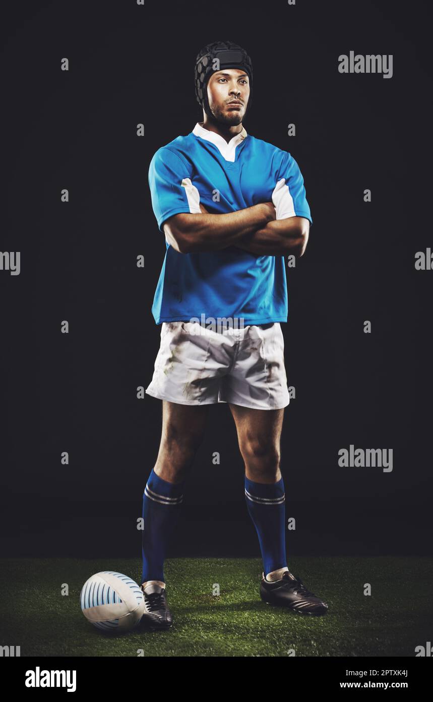 Ready for this. Full length studio shot of a young rugby player on the ...
