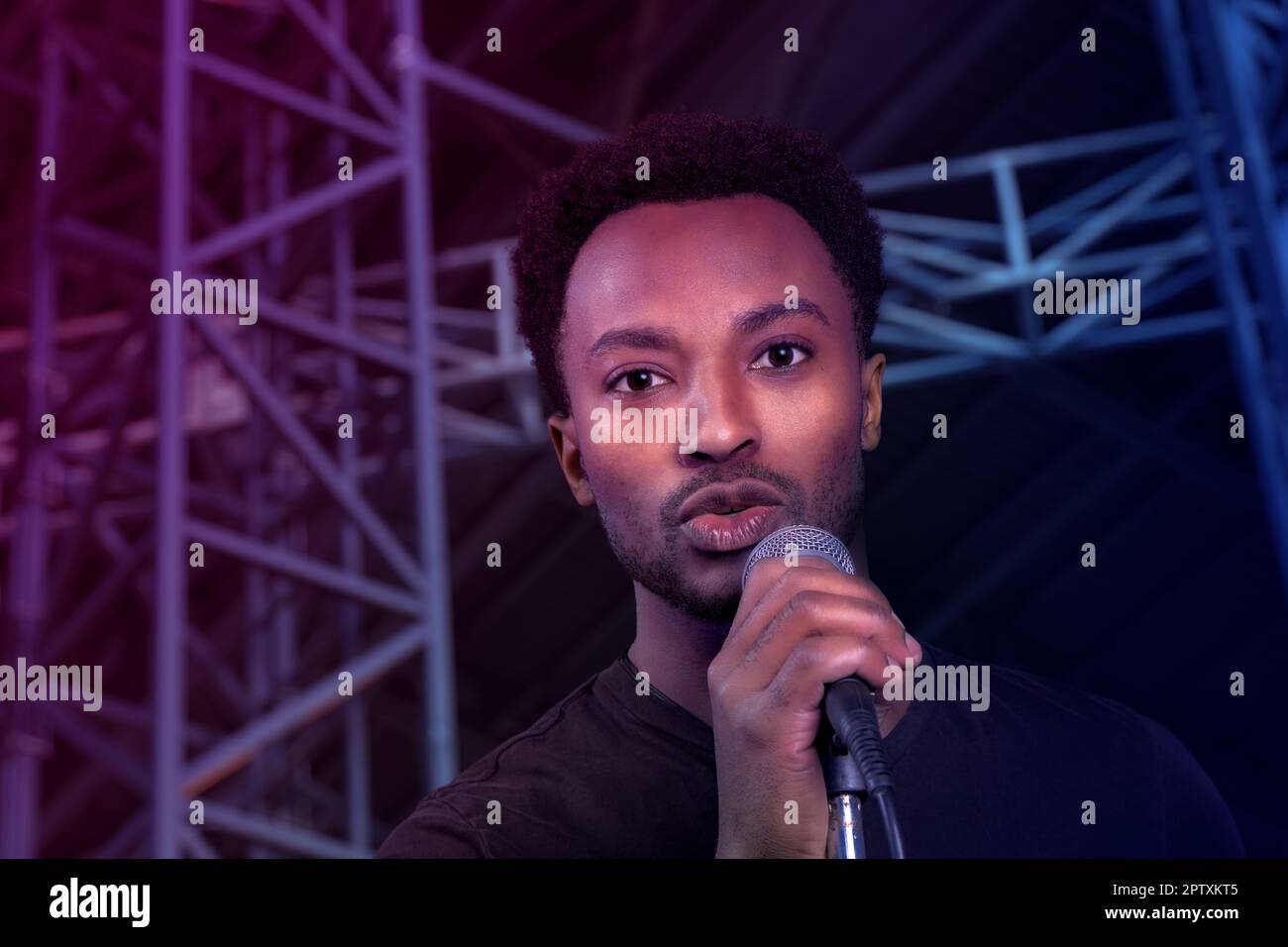 pop singer on stage singing song live show rock star vocal performance ...