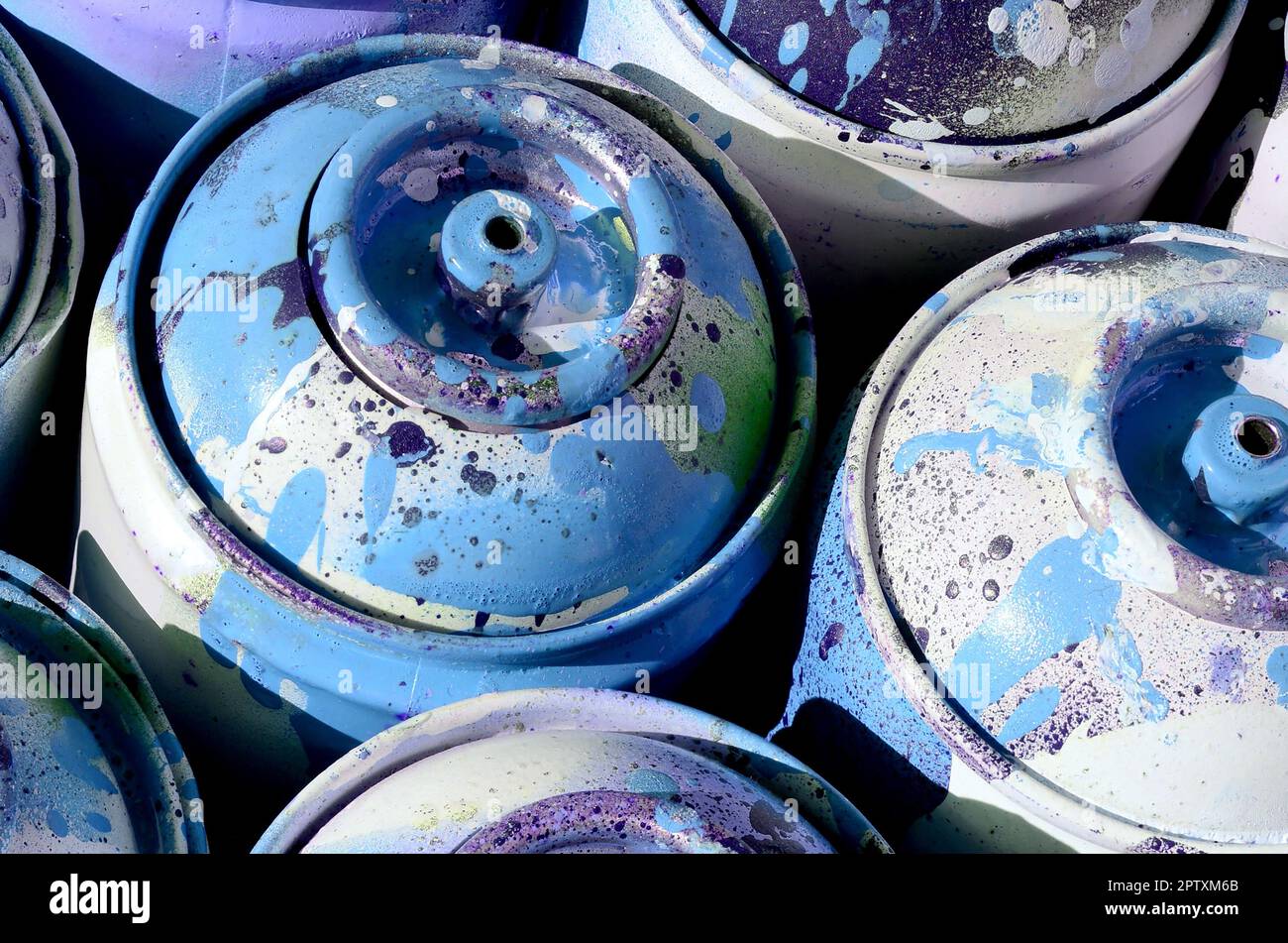 A lot of used blue metal tanks with paint for drawing graffiti Stock ...