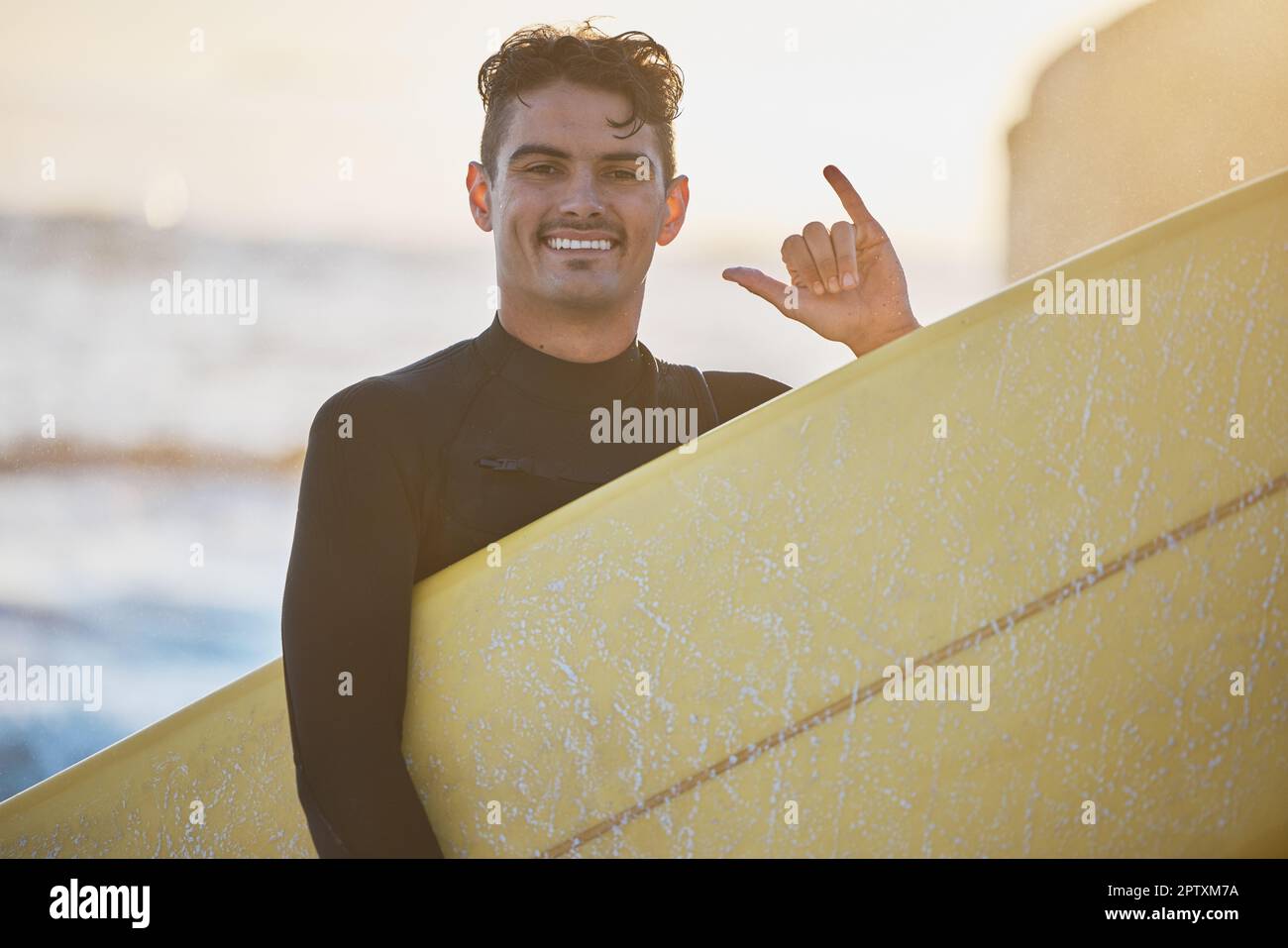 Man, surfer and shaka in beach portrait with surfboard, smile or hang ...