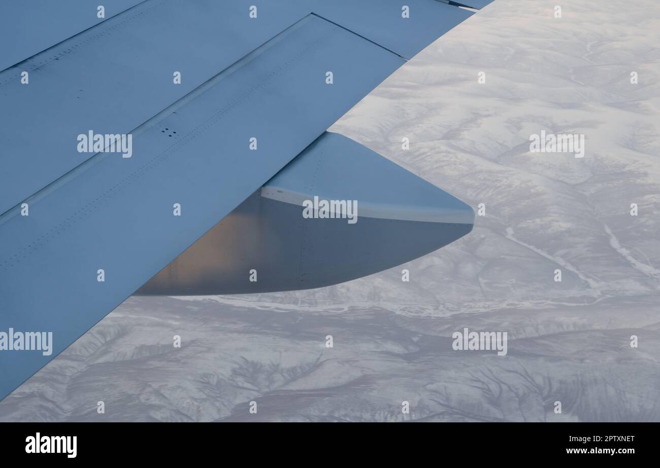 Detail of the wing of an aircraft flying over Siberia. Russia Stock ...