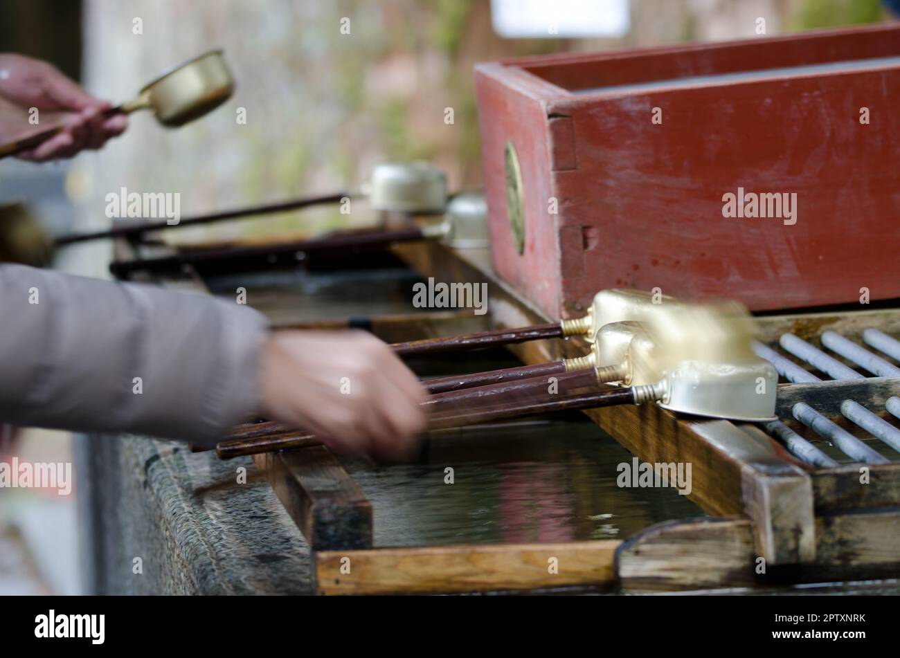 People performing ablutions, ceremonial purification rite known as ...