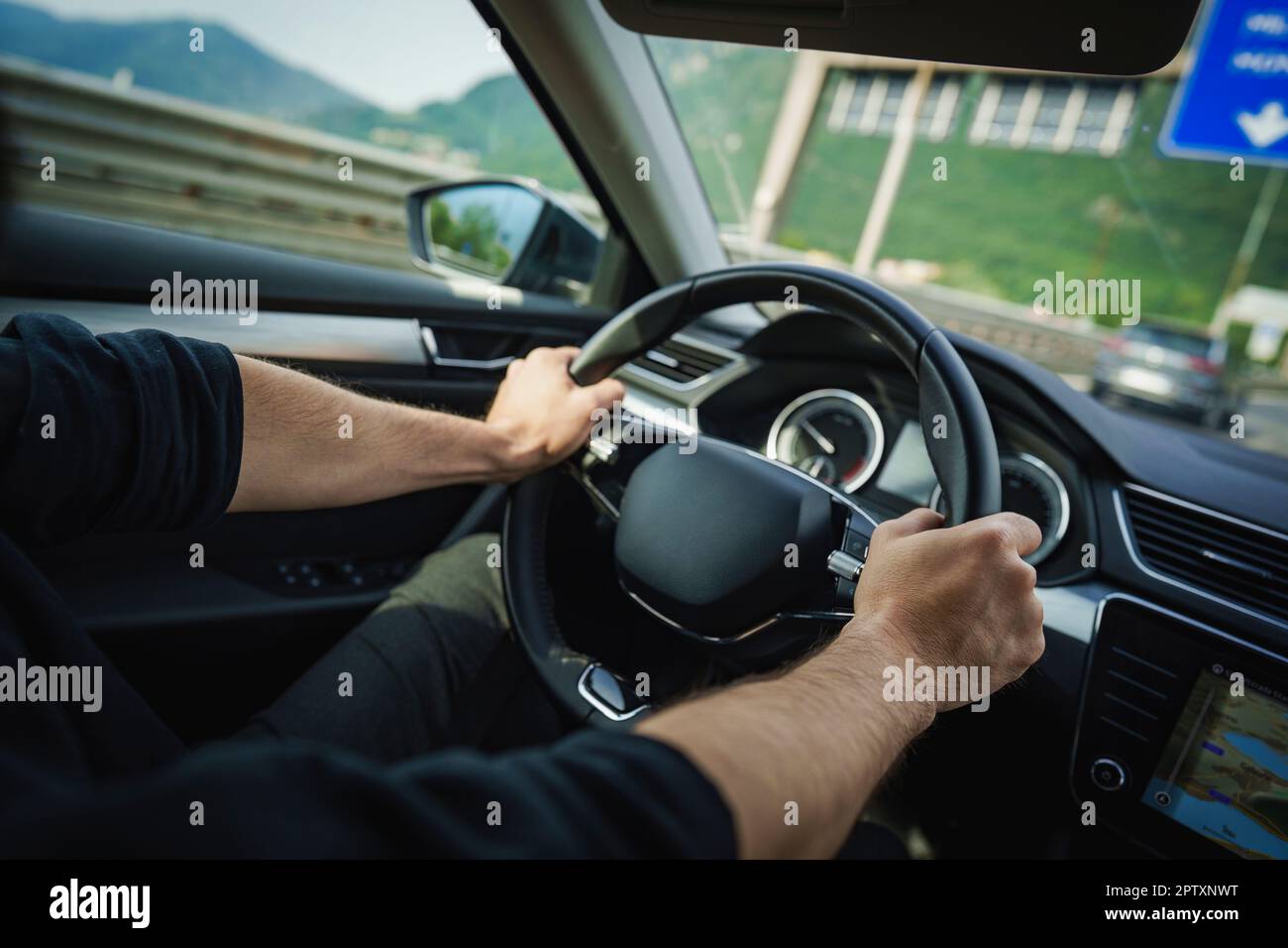 Hands driving cars steering wheel hi-res stock photography and images ...