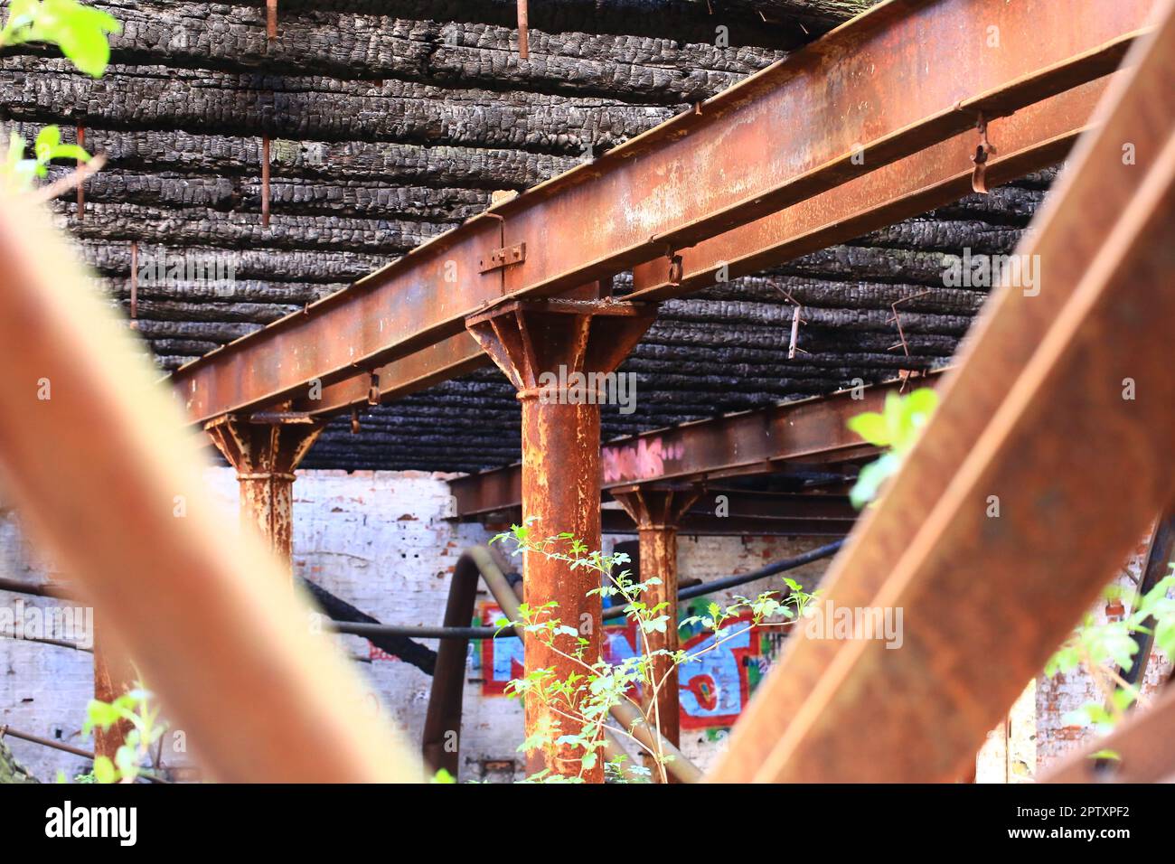 Burnt wooden beams and steel girders in a ruin Stock Photo - Alamy
