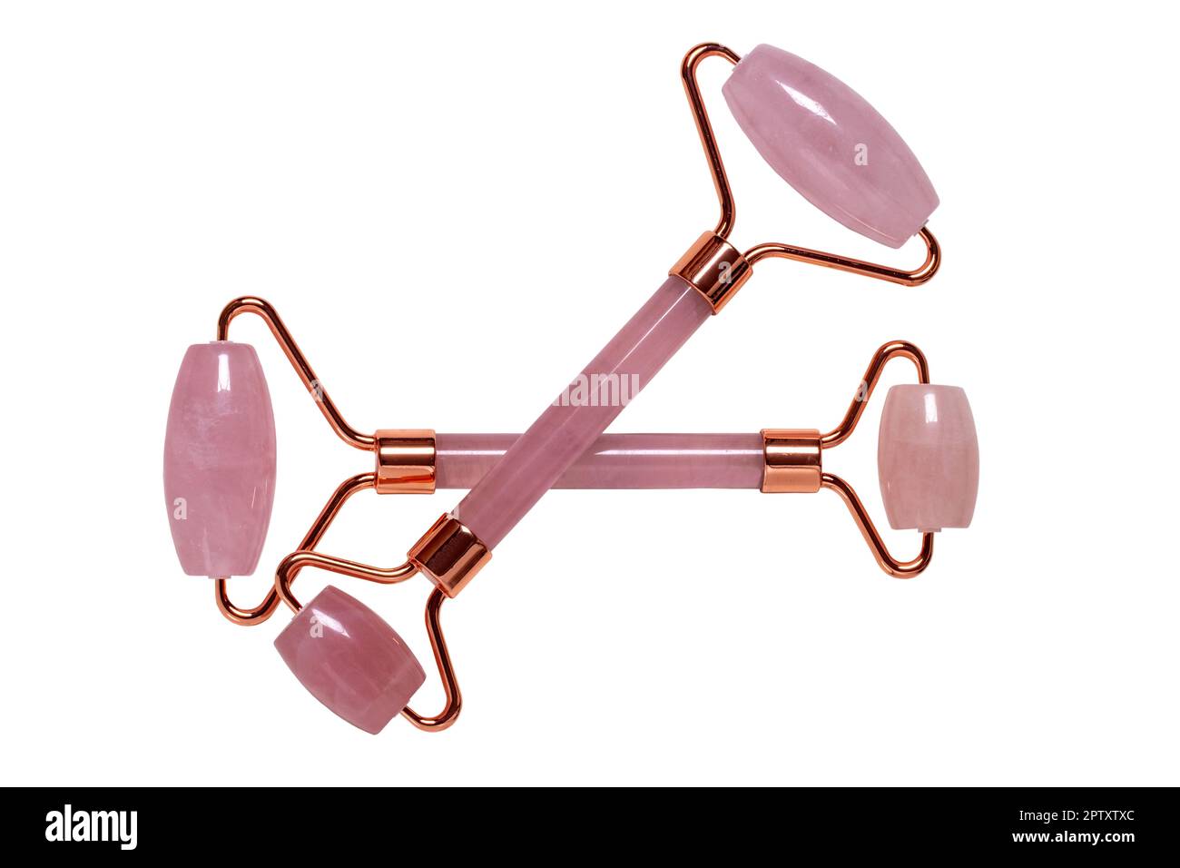 Gua Sha massage tools. Close-up of two pink jade facial roller or ... Gua Sha massage tools. Close-up of two pink jade facial roller or ...
