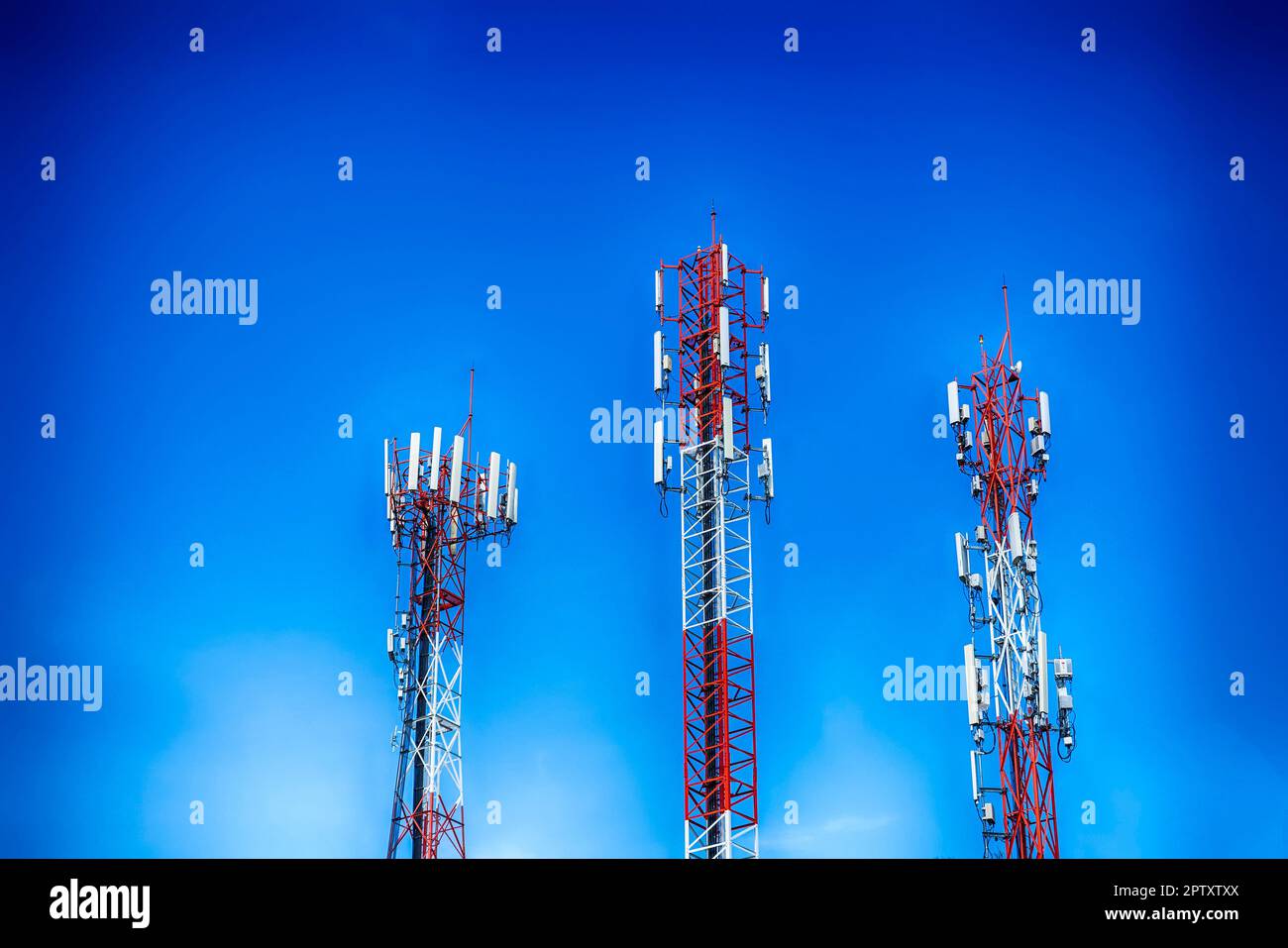 Three communication tower transmission signal with blue sky Stock Photo ...