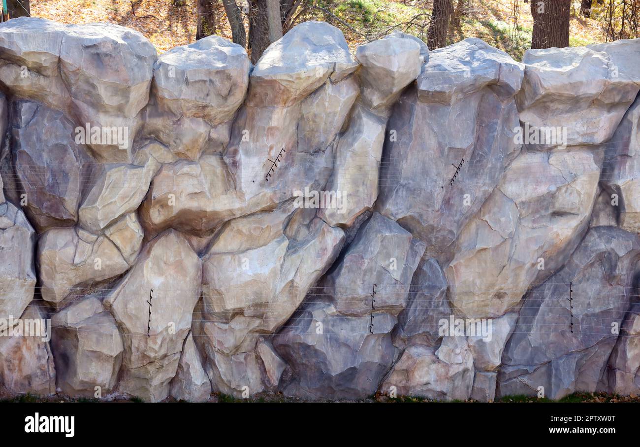 Texture of a stone wall with many big brown and grey stones armed with ...