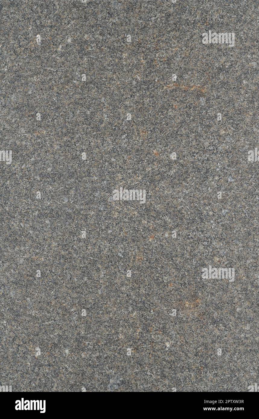 The texture of solid granite tiles. Hard and slippery gray granite ...