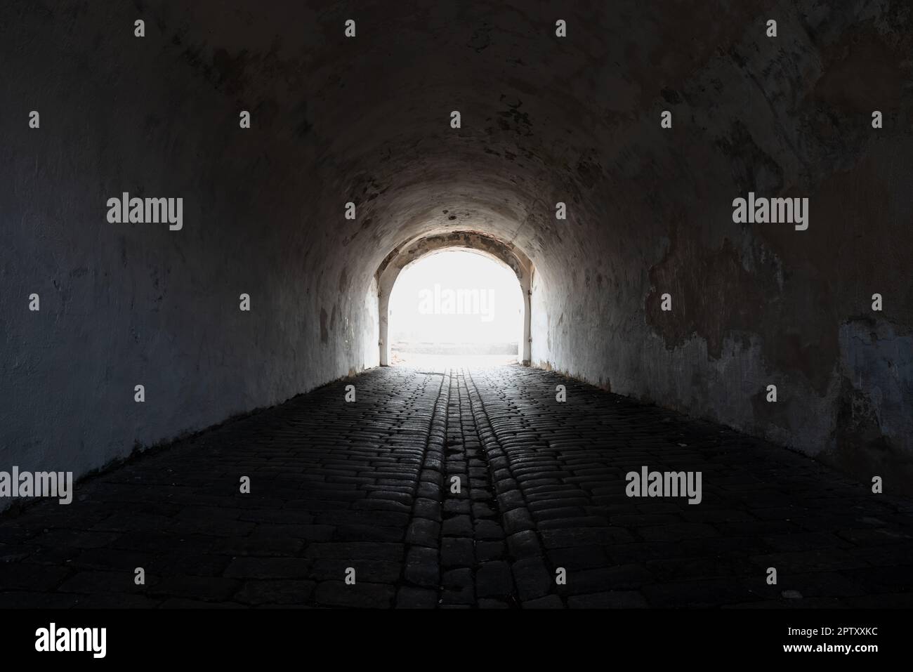 Perspective view of an empty dark tunnel with bright glowing end Stock ...