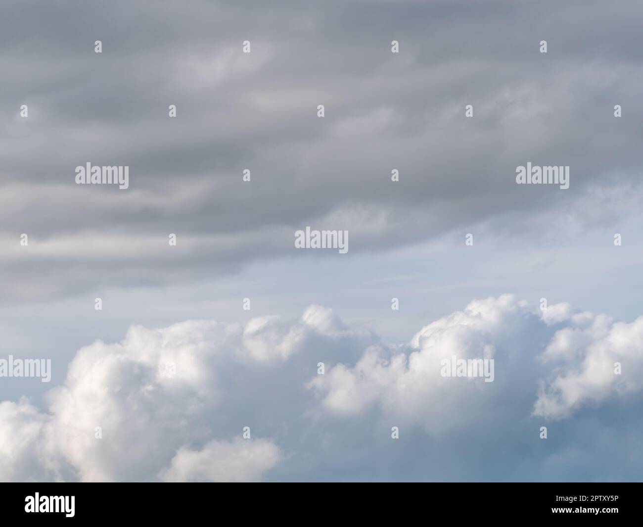 Gray cumulus clouds in the sky. Dramatic skies, landscape. The sky is ...