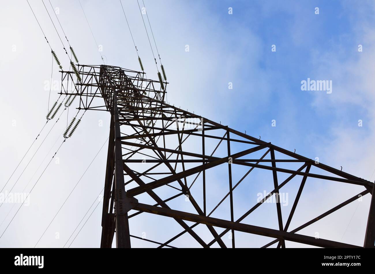 The silhouette of the electricity transmission pylon in daytime outdoors. Electricity Pylon ...