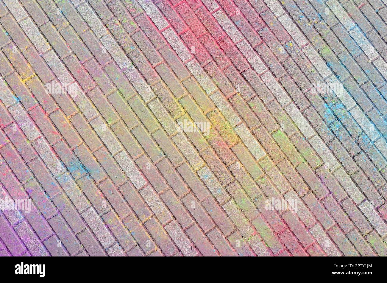 Multi colored earth, paving slabs, powder coated with dry colors at the ...