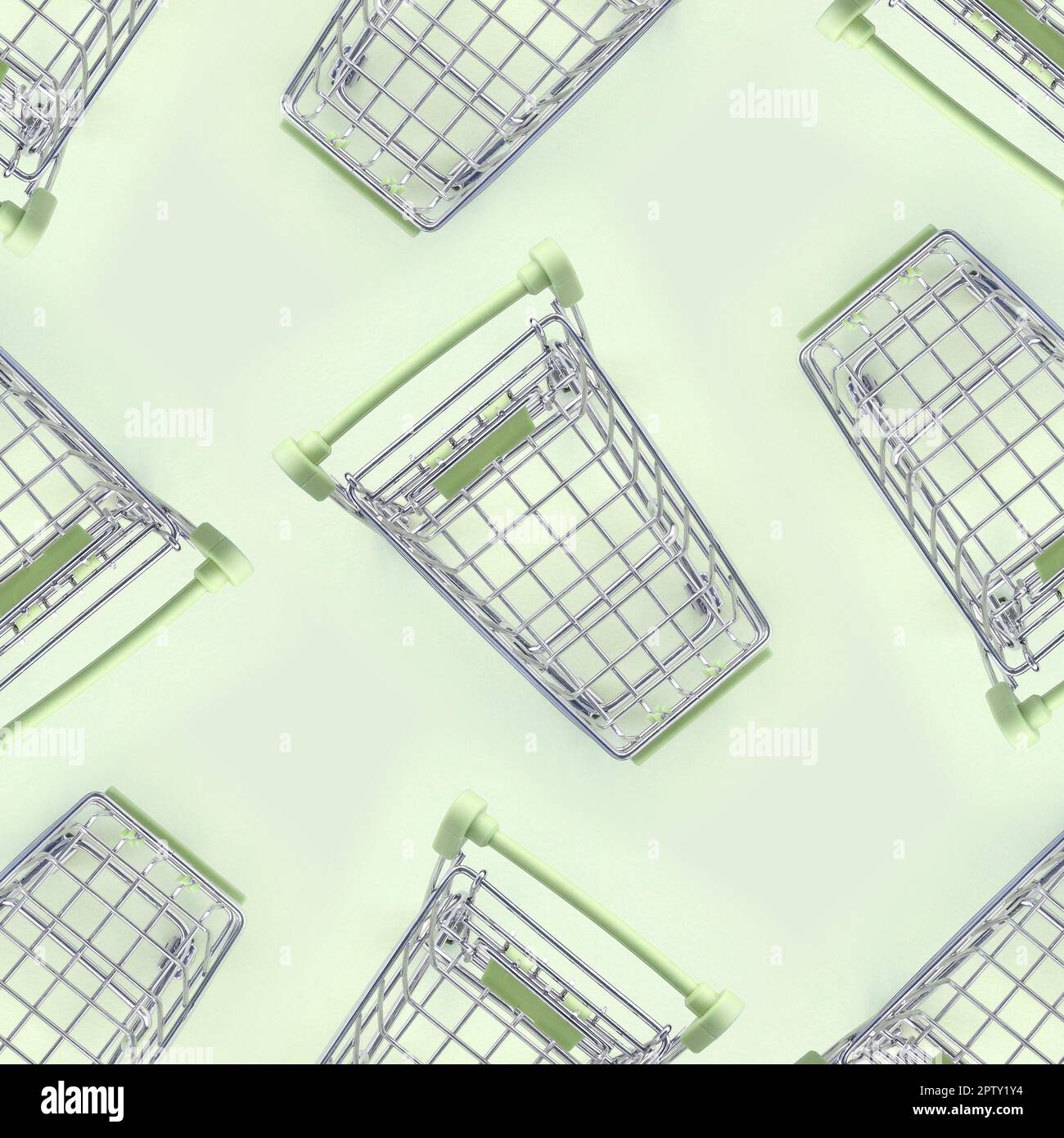 Pattern of many small shopping carts on a lime background. Minimalism ...