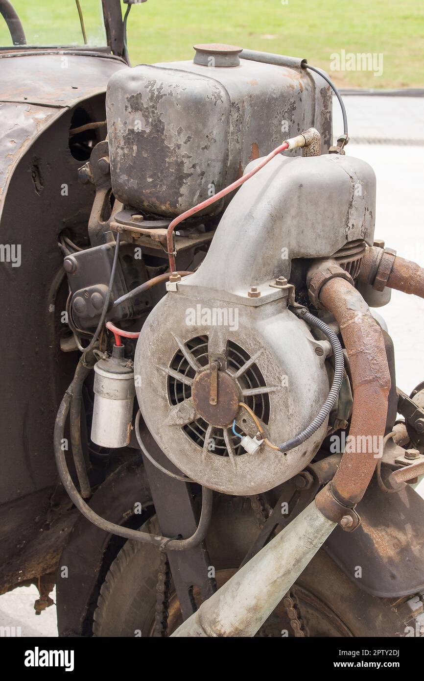 Vintage car engine on the front wheel Stock Photo - Alamy