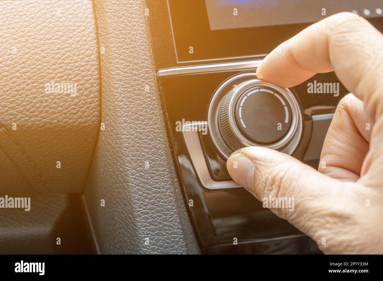 Adjust the air conditioner in the car Stock Photo - Alamy
