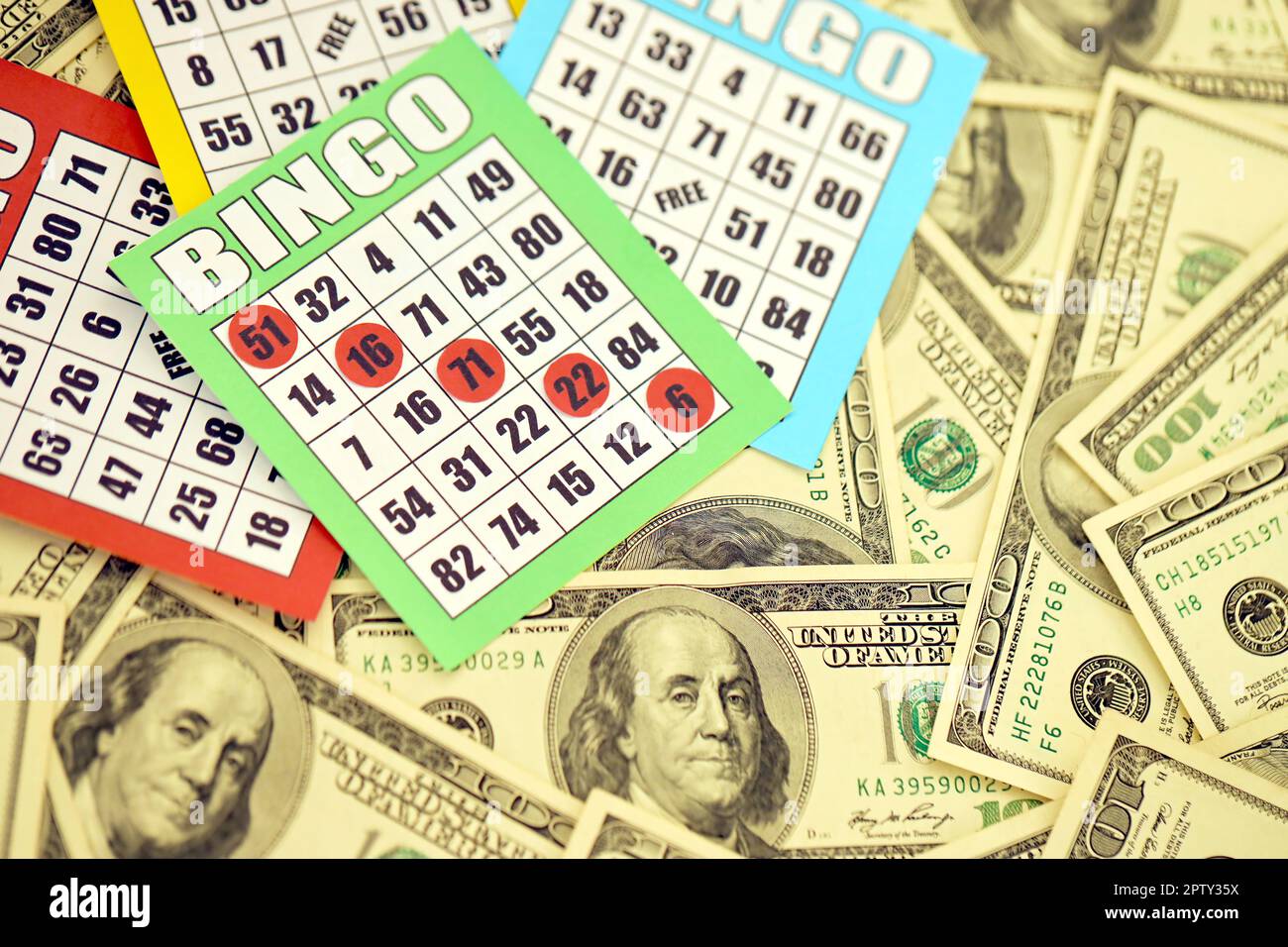 Many bingo boards or playing cards for winning chips and big amount of ...
