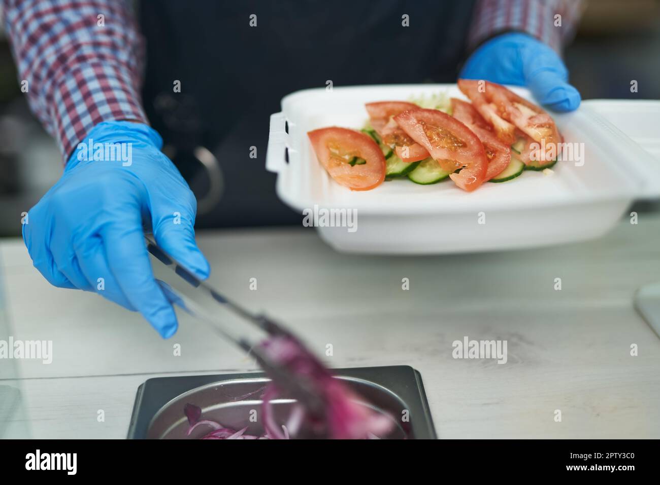 The cook preparing healthy vegetarian lunch box for take away. Kitchen ...