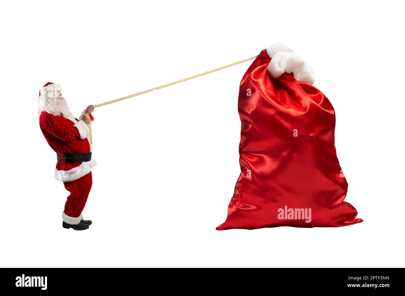 Santa claus pulls a rope to move a big sack Stock Photo - Alamy