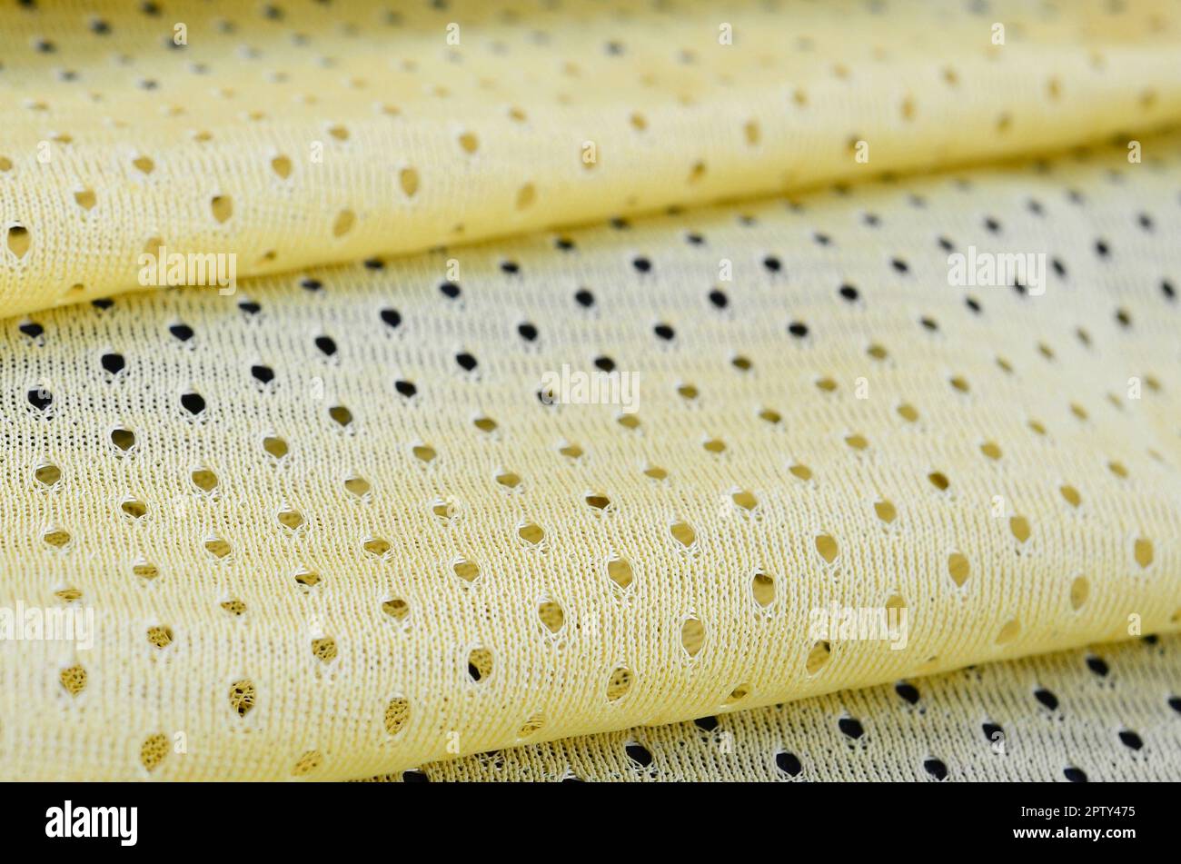 Yellow mesh sport wear fabric textile pattern background. Yellow color ...