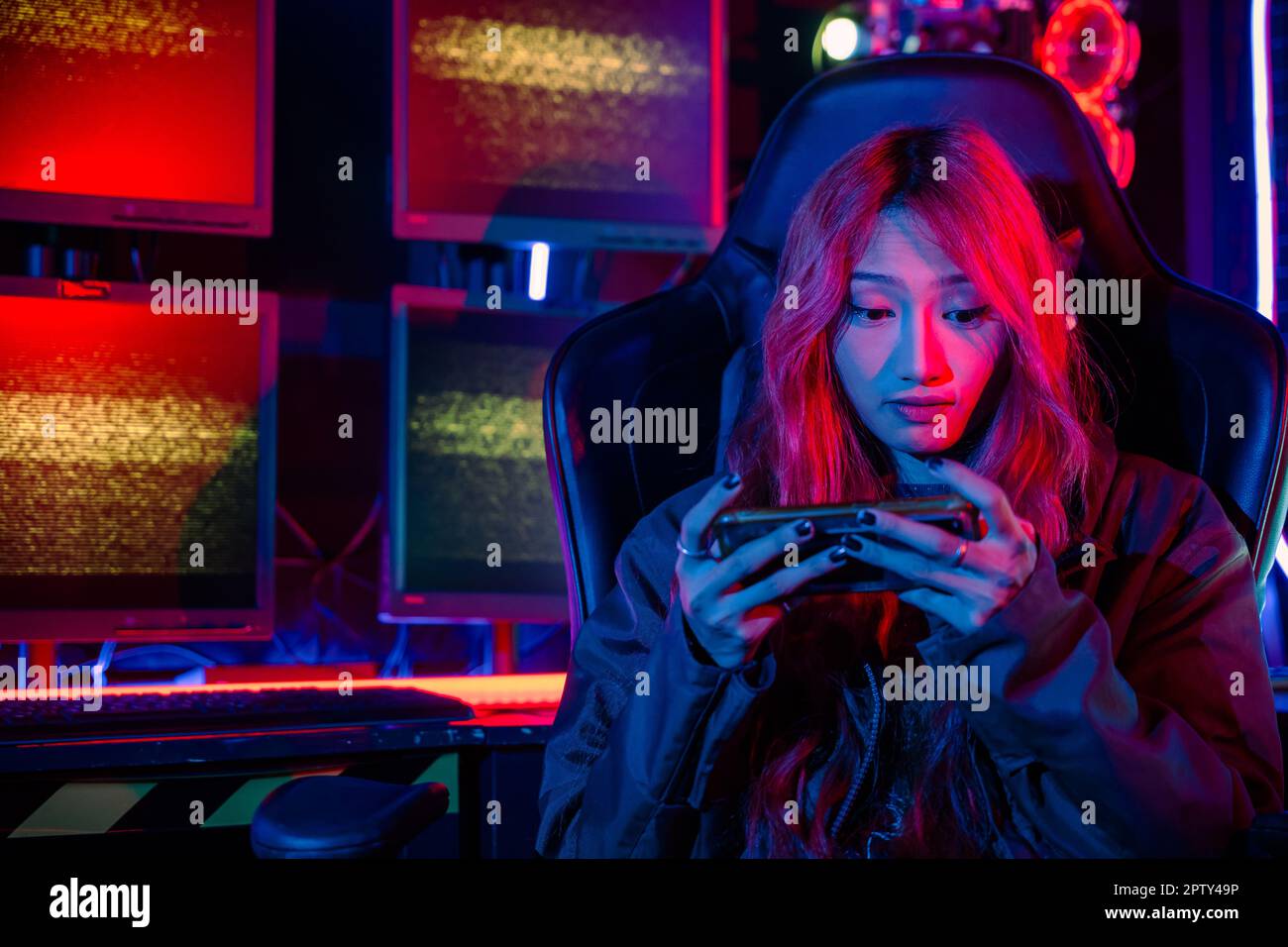 Gamer playing online game application on mobile phone wear gaming ...