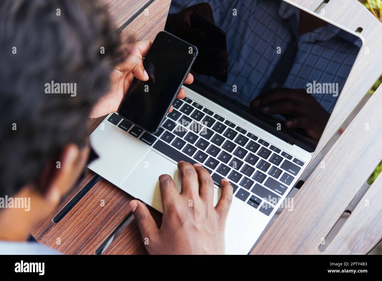 Happy Asian hand black man person working with laptop computer and ...