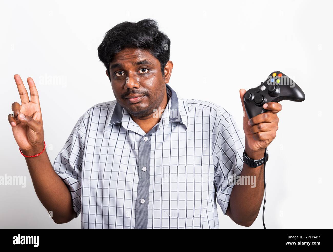 Asian happy portrait young black man funny use hand playing video game ...