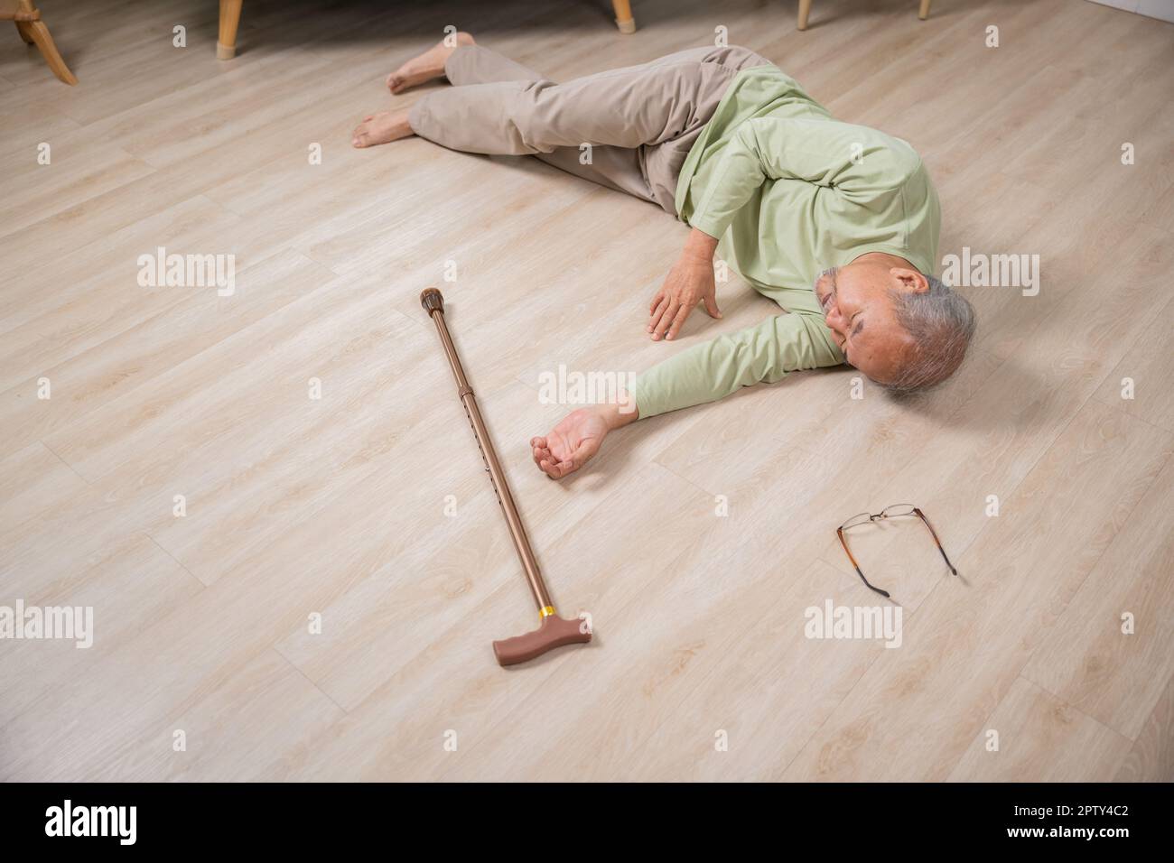 Sick senior old man falling down lying on the ground because stumbled ...