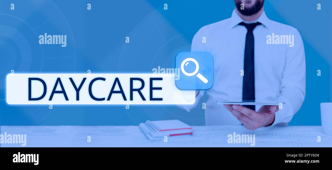 Hand writing sign Daycare, Word for offering care to preschool children ...