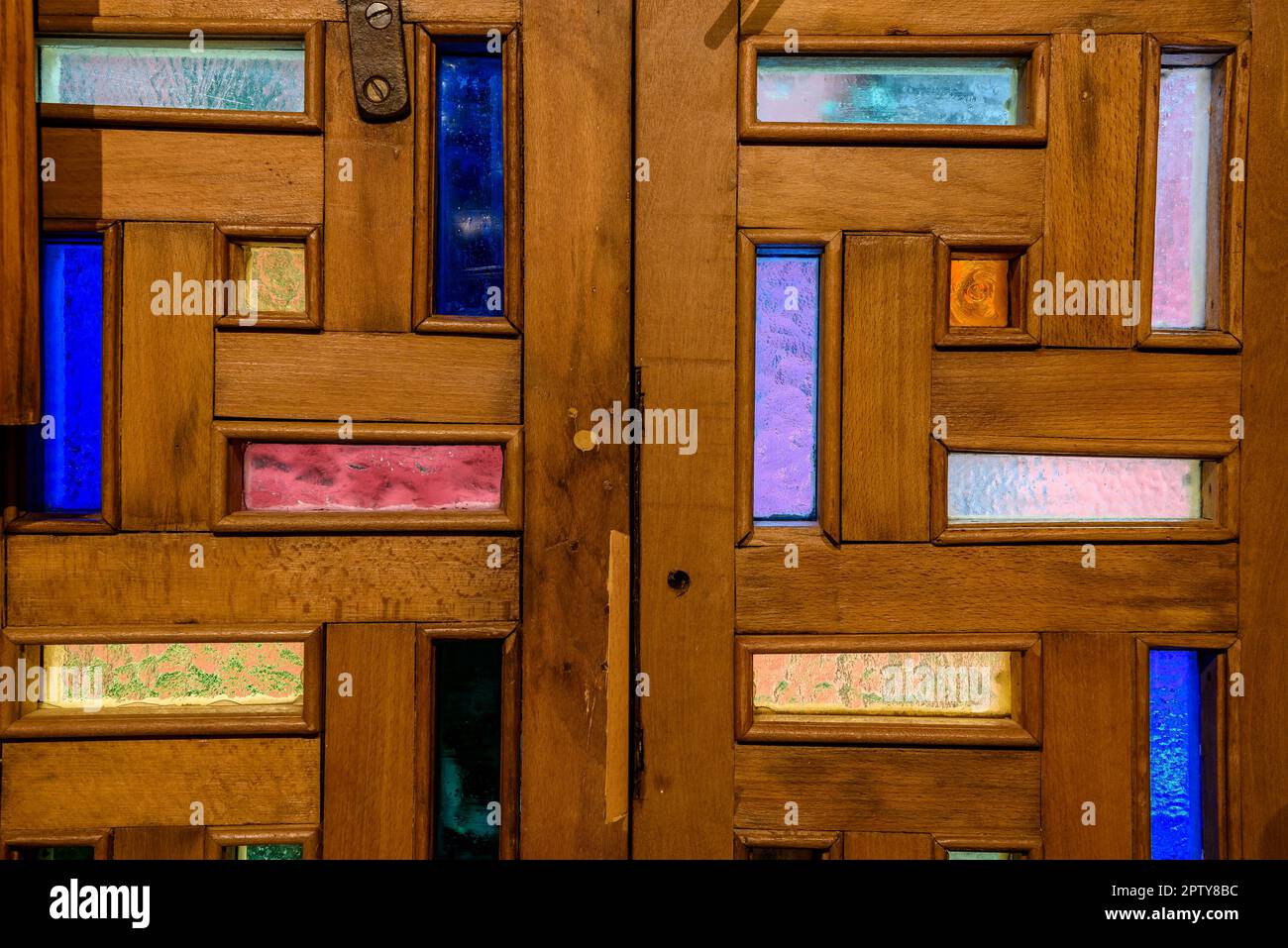 Detail of a door and stained glass windows in the smoking room of the ...