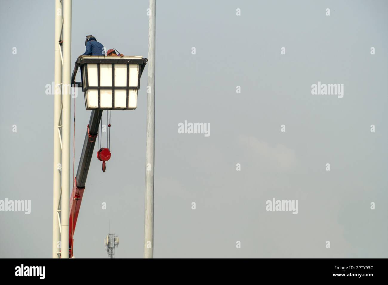 Use crane to lift the light bulbs to repair the light pole Stock Photo ...