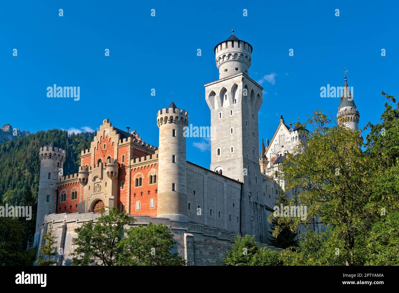 Front view of the facade of Neuschwanstein Castle with entrance area ...
