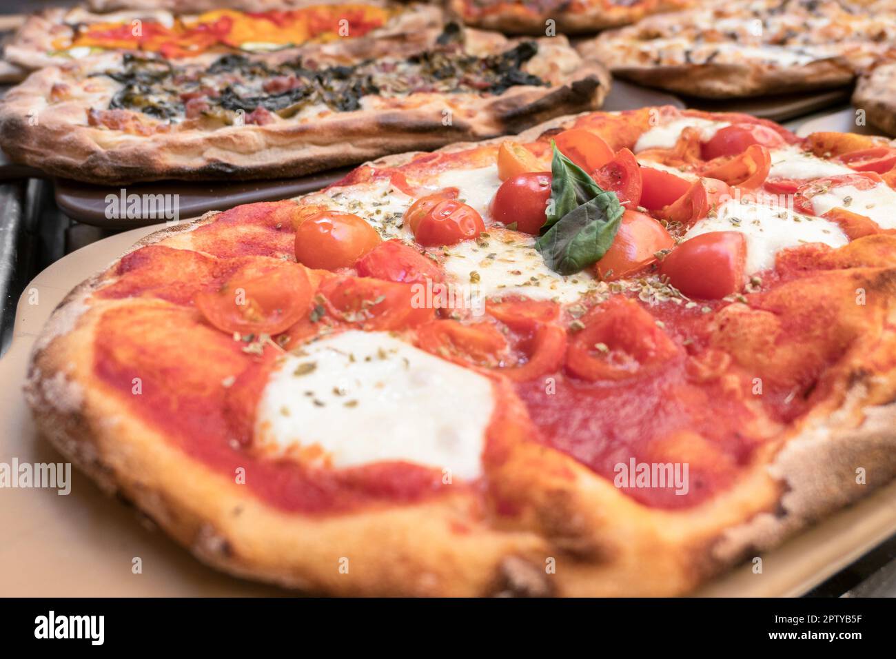 Italian pizza close-up. Close up of italian pizza on cutting board ...