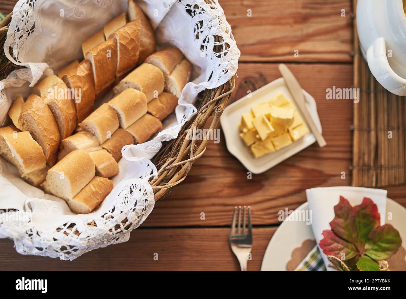 Buffet table, flatlay of bakery bread with butter in buffet and kitchen ...