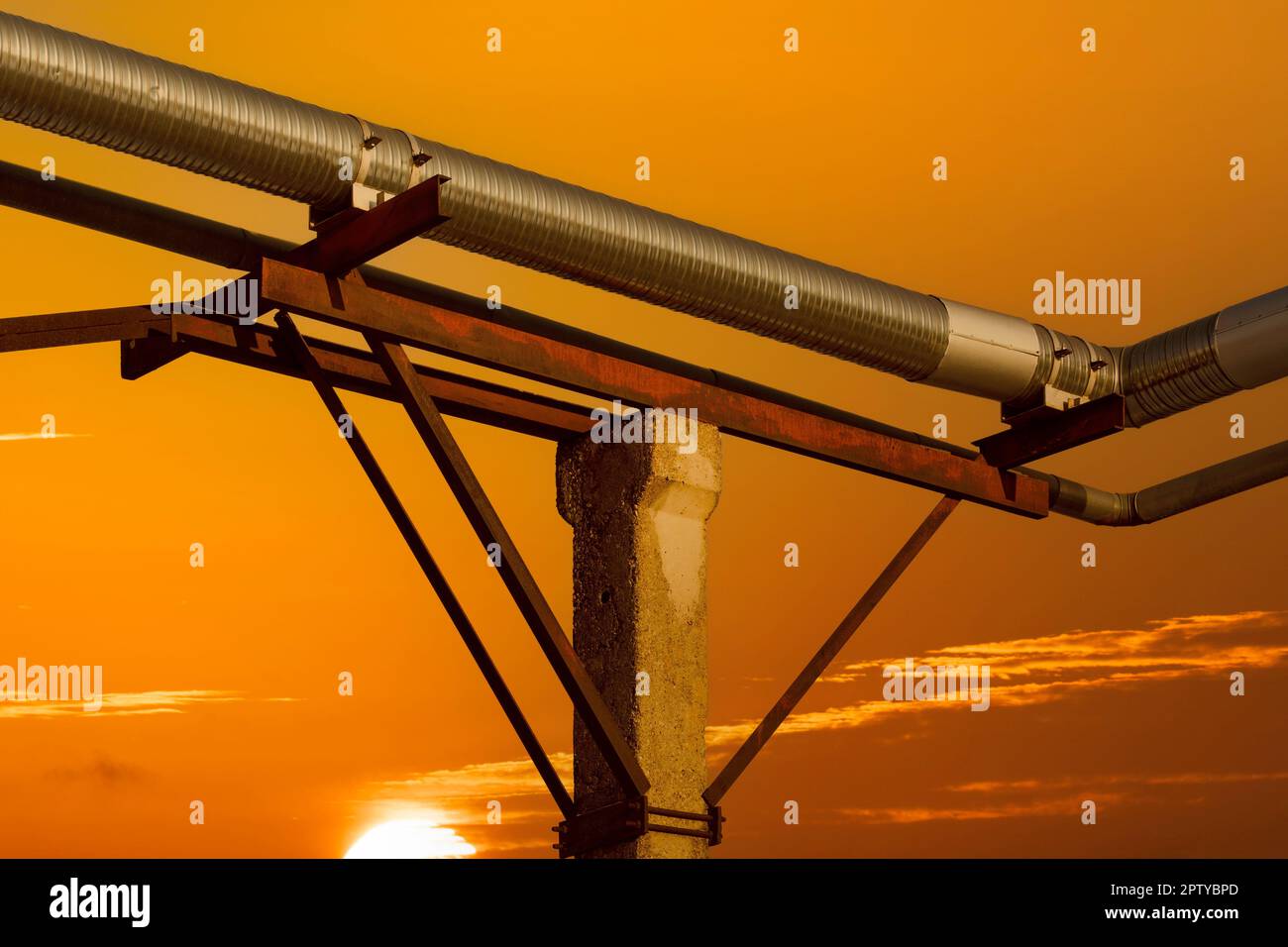 Bottom shot of a pipeline on evening sky background. Pipeline ... Bottom shot of a pipeline on evening sky background. Pipeline ...