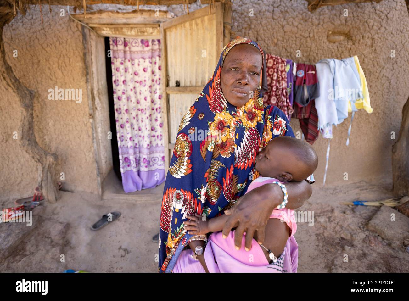 An elderly woman holds her sleeping grandson in Segou Region, Mali ...