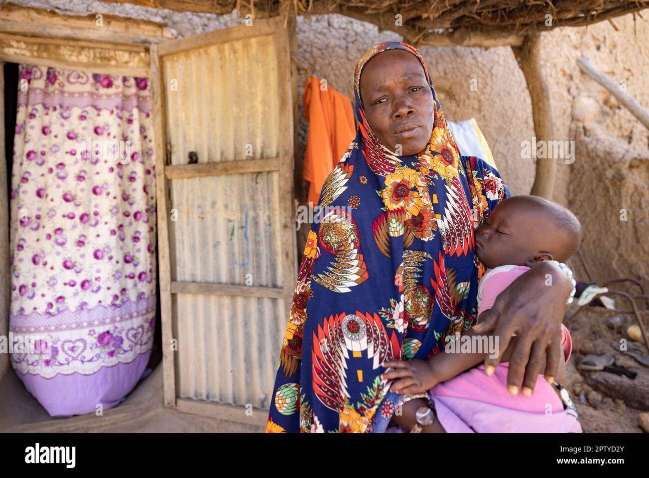 An elderly woman holds her sleeping grandson in Segou Region, Mali ...