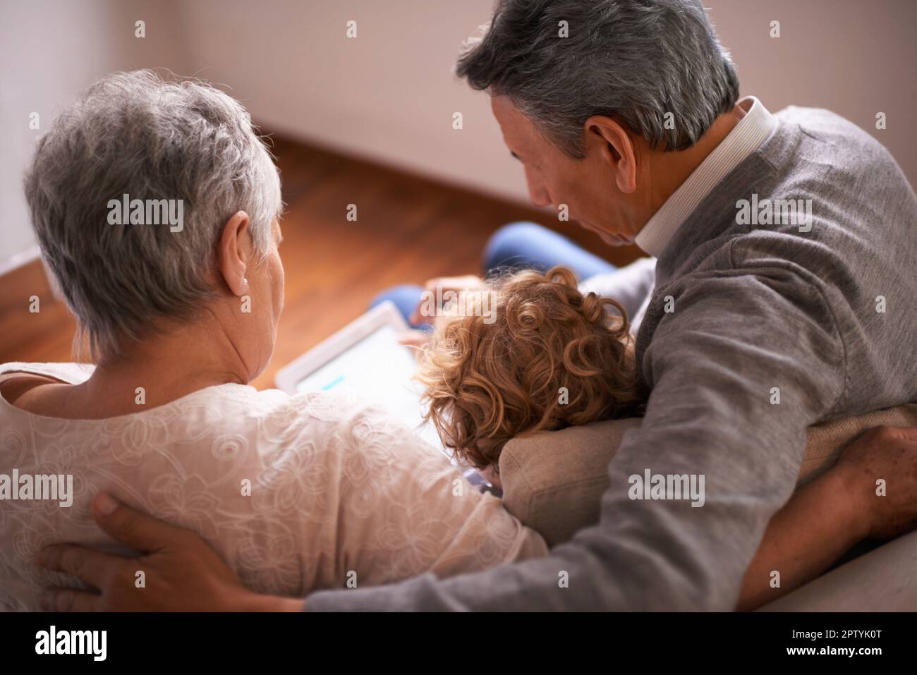 Child and ipad and grandparents hi-res stock photography and images - Alamy