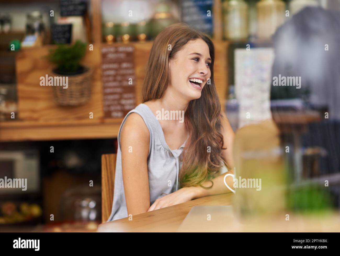 Catching up with old friends. a group of friends talking in a cafe ...