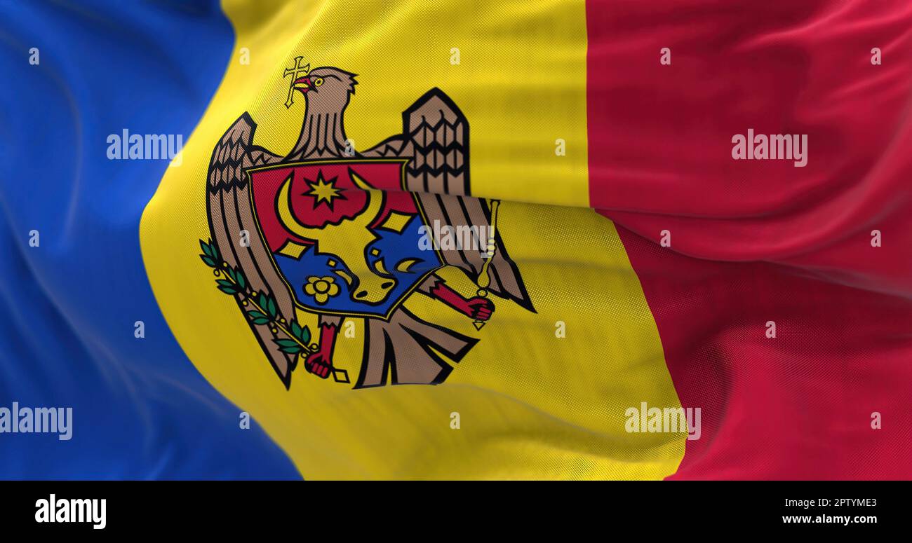 Close-up view of the Moldova national flag waving in the wind. Republic ...