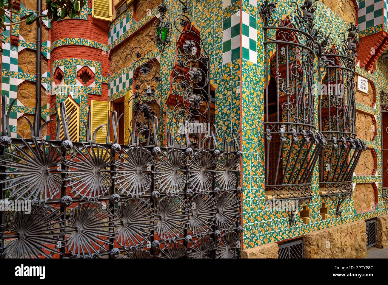 Facade of Casa Vicens and wrought iron fence with Mediterranean dwarf ...