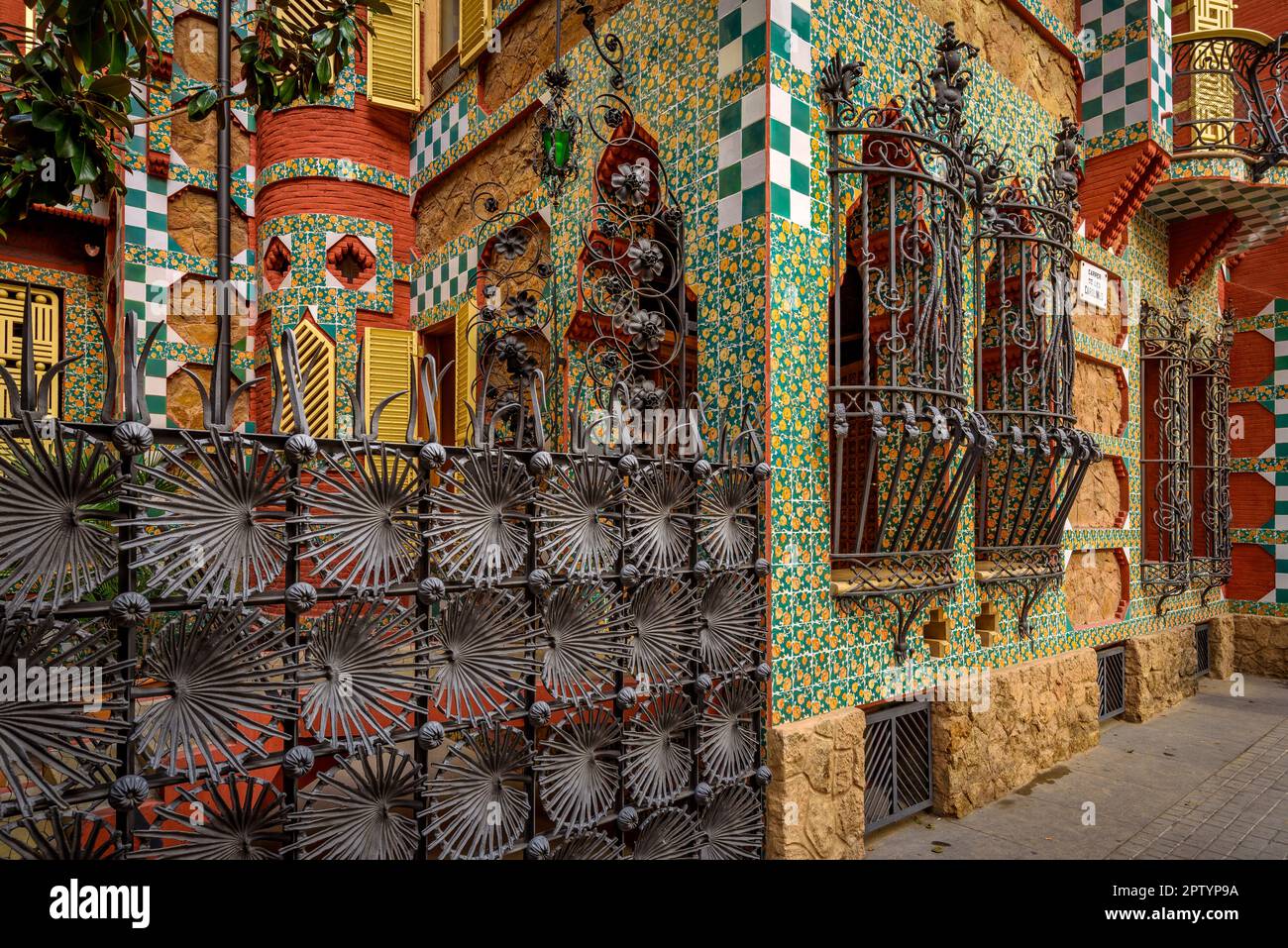 Facade of Casa Vicens and wrought iron fence with Mediterranean dwarf ...