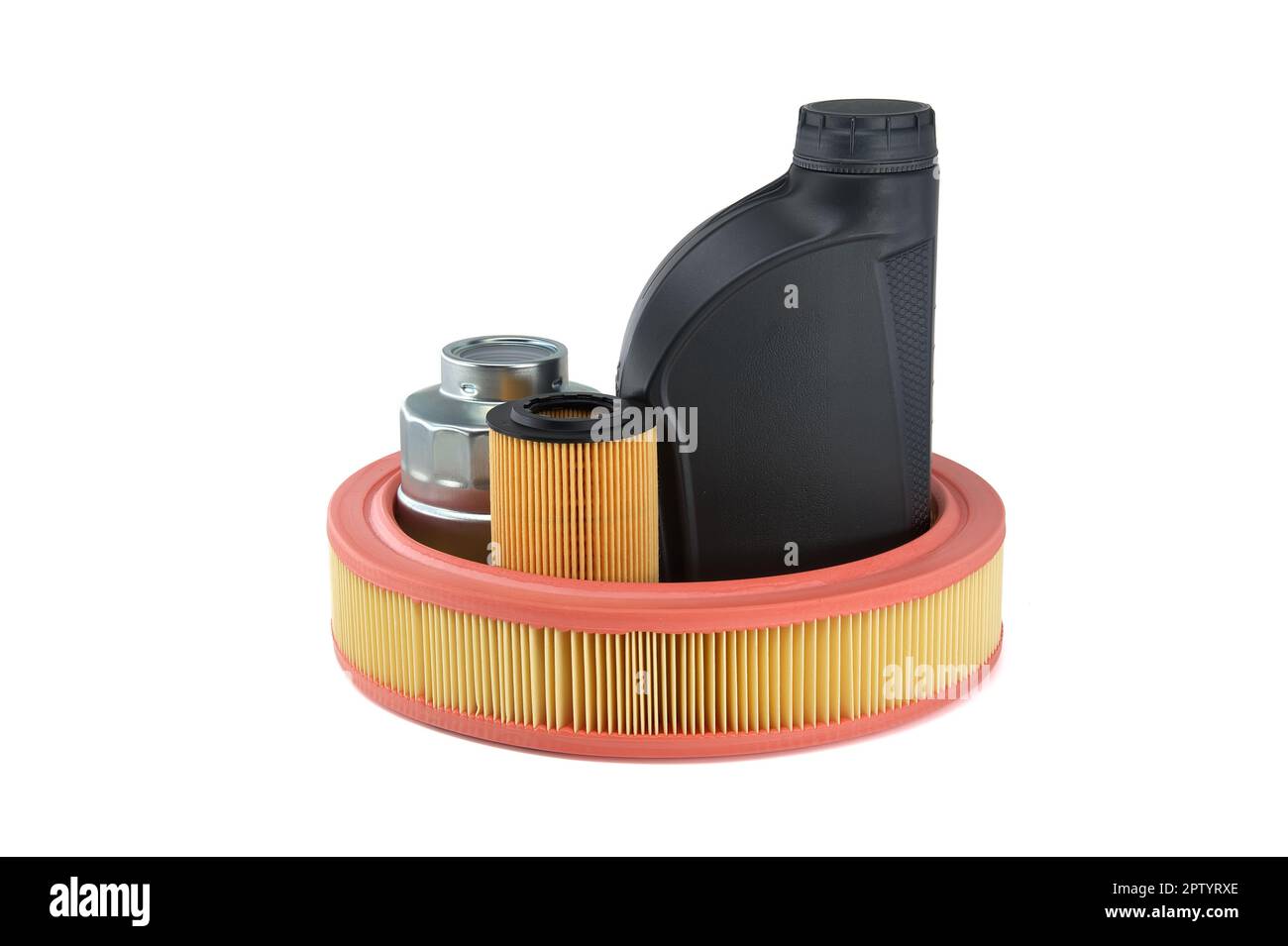 Vehicle engine round air filter, fuel and oil filters near motor oil ...